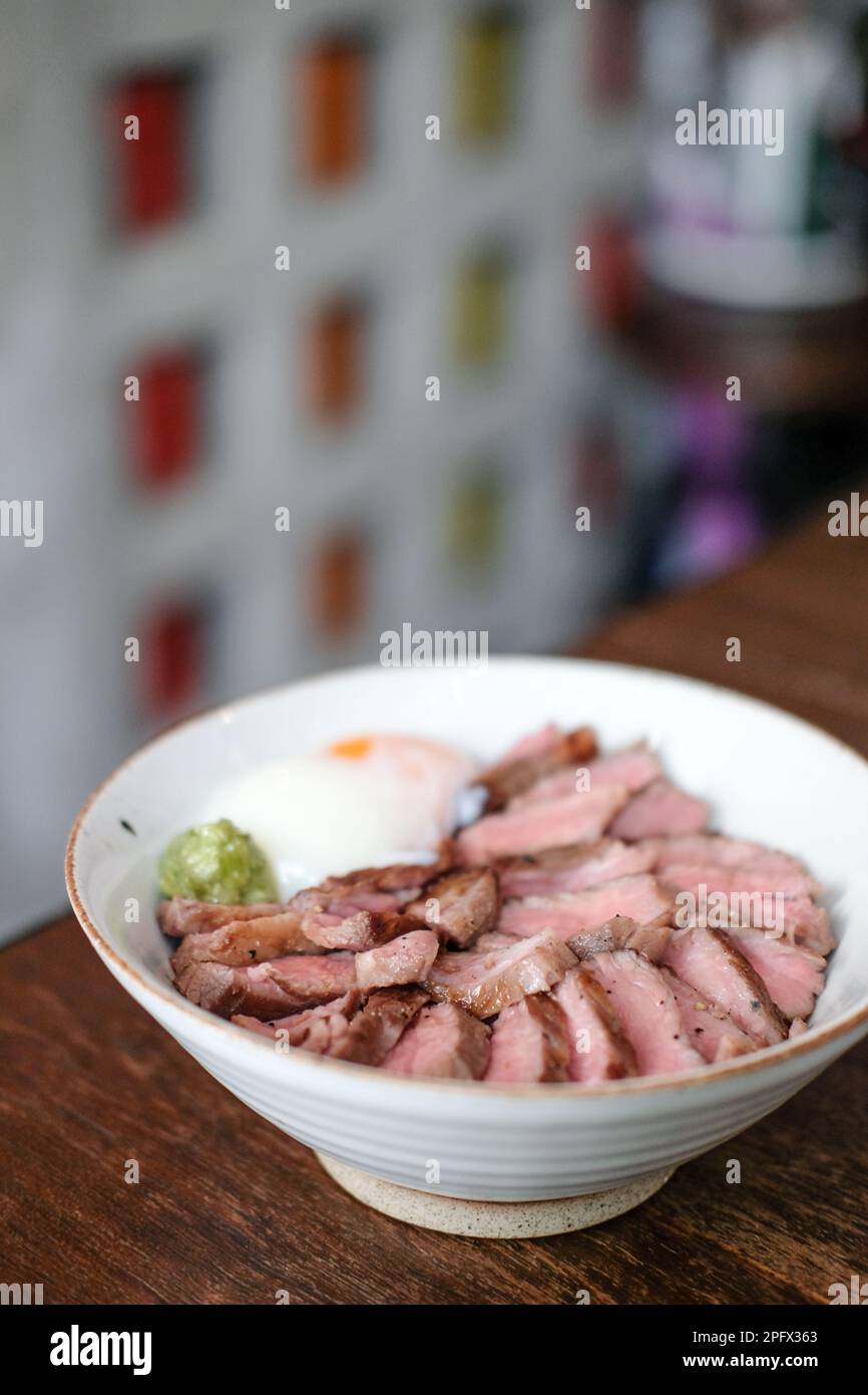Steak Don, a Japanese dish consisting of a bowl of rice topped with ...