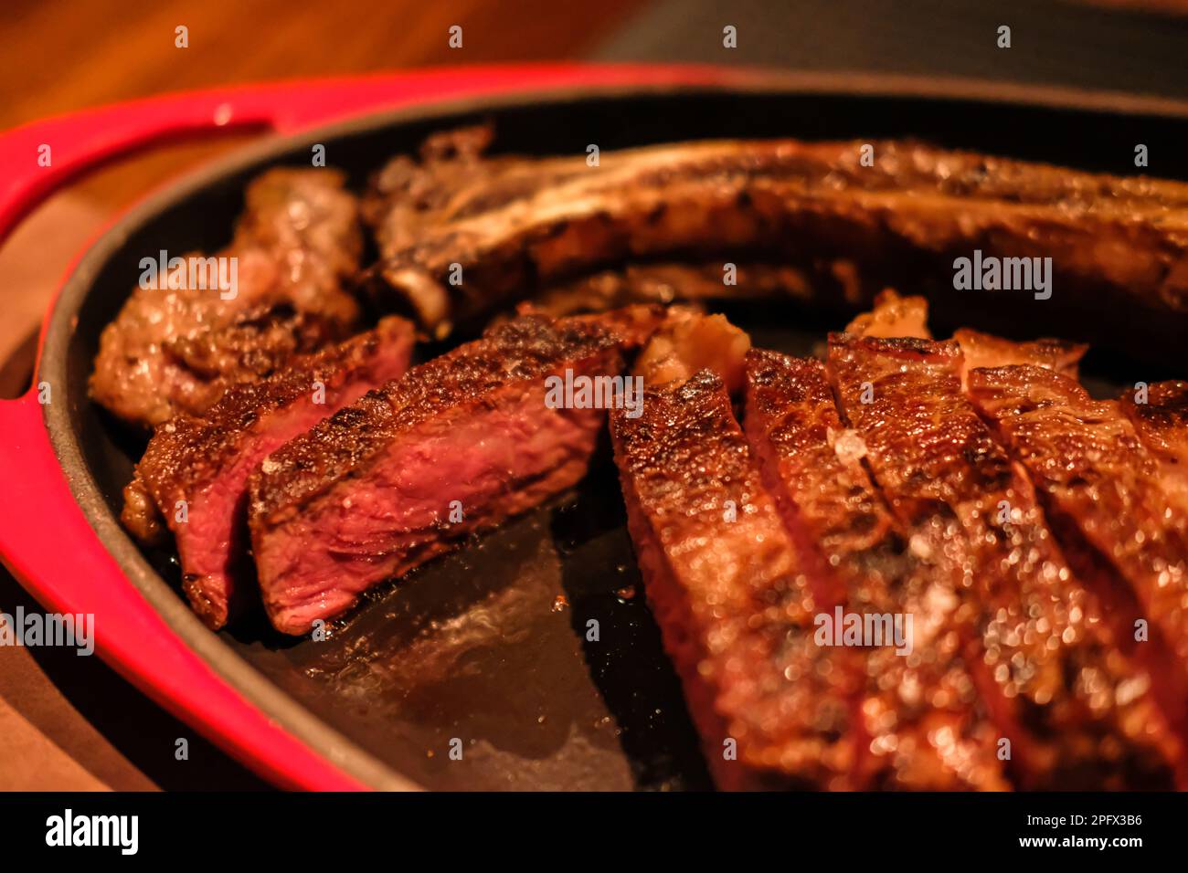 Medium rare meat on plate in the restaurant Stock Photo - Alamy