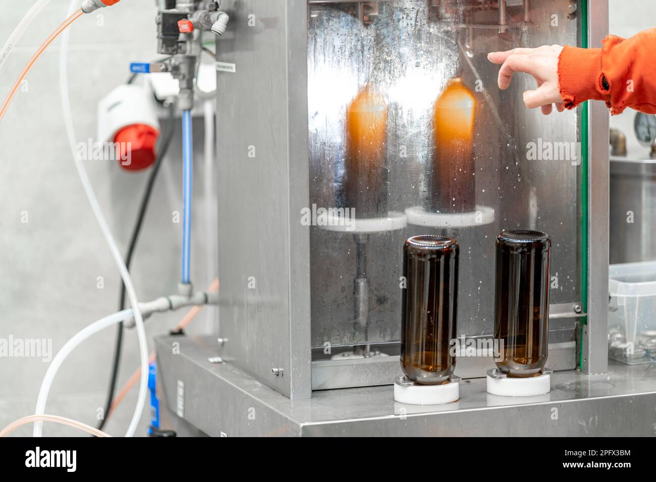machine for automatic filling of beer bottles in a brewery Stock Photo ...