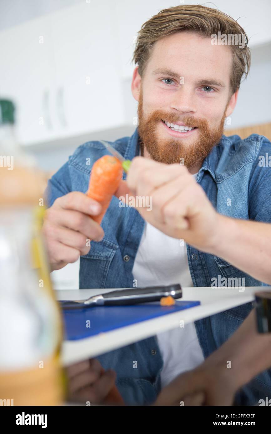 Handsome guy eating hi-res stock photography and images - Alamy