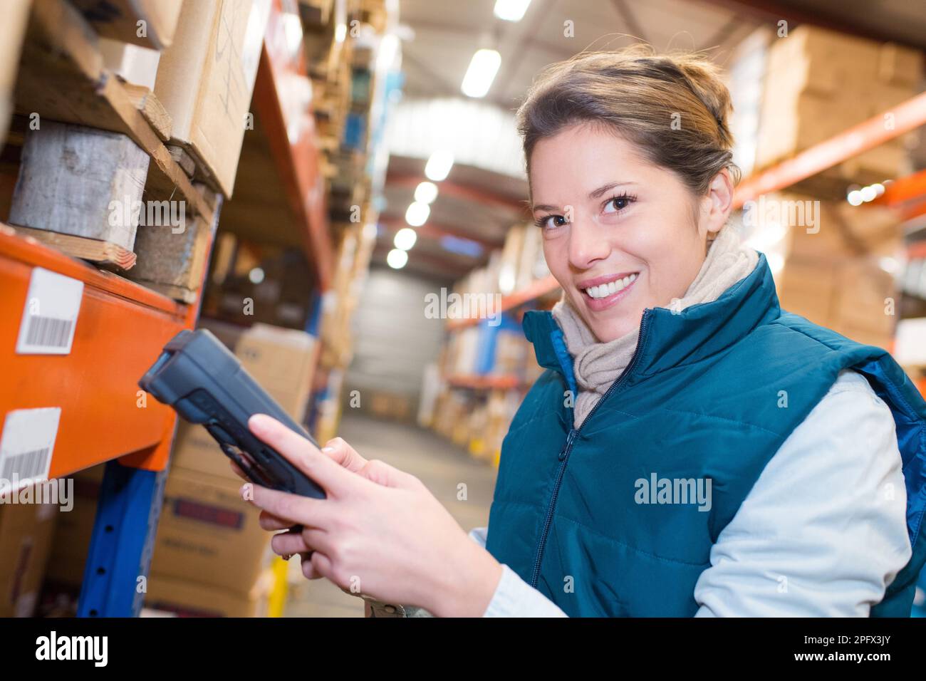 warehouse female worker scanning barcodes on boxes Stock Photo - Alamy