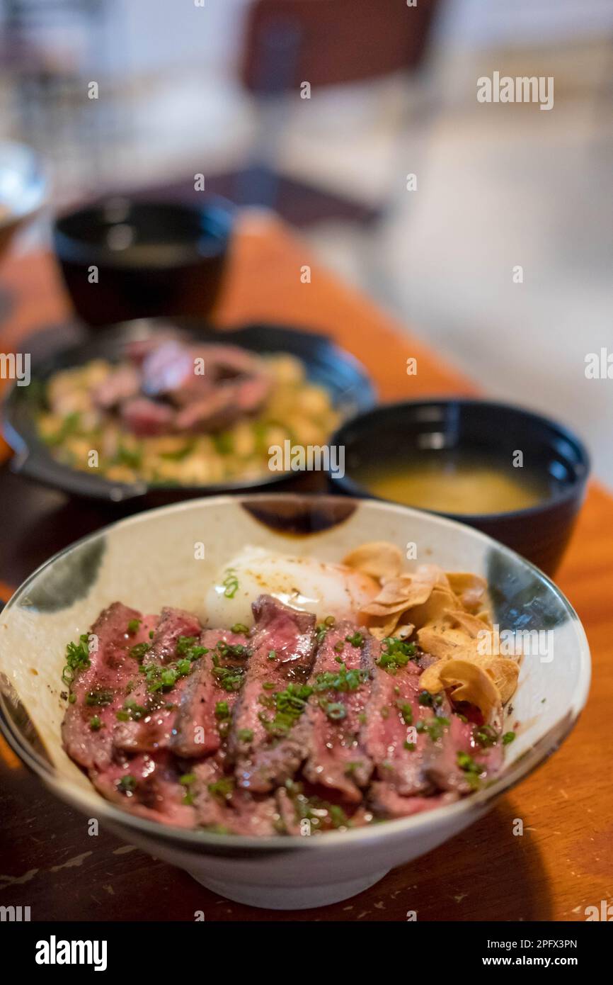 Steak Don, a Japanese dish consisting of a bowl of rice topped with ...