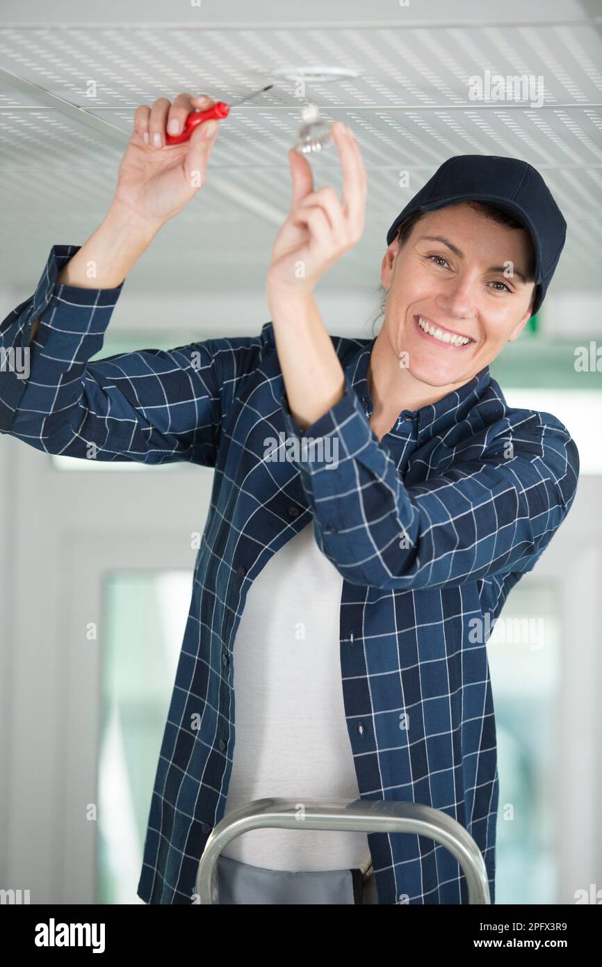 Female installing electric wiring in hi-res stock photography and ...