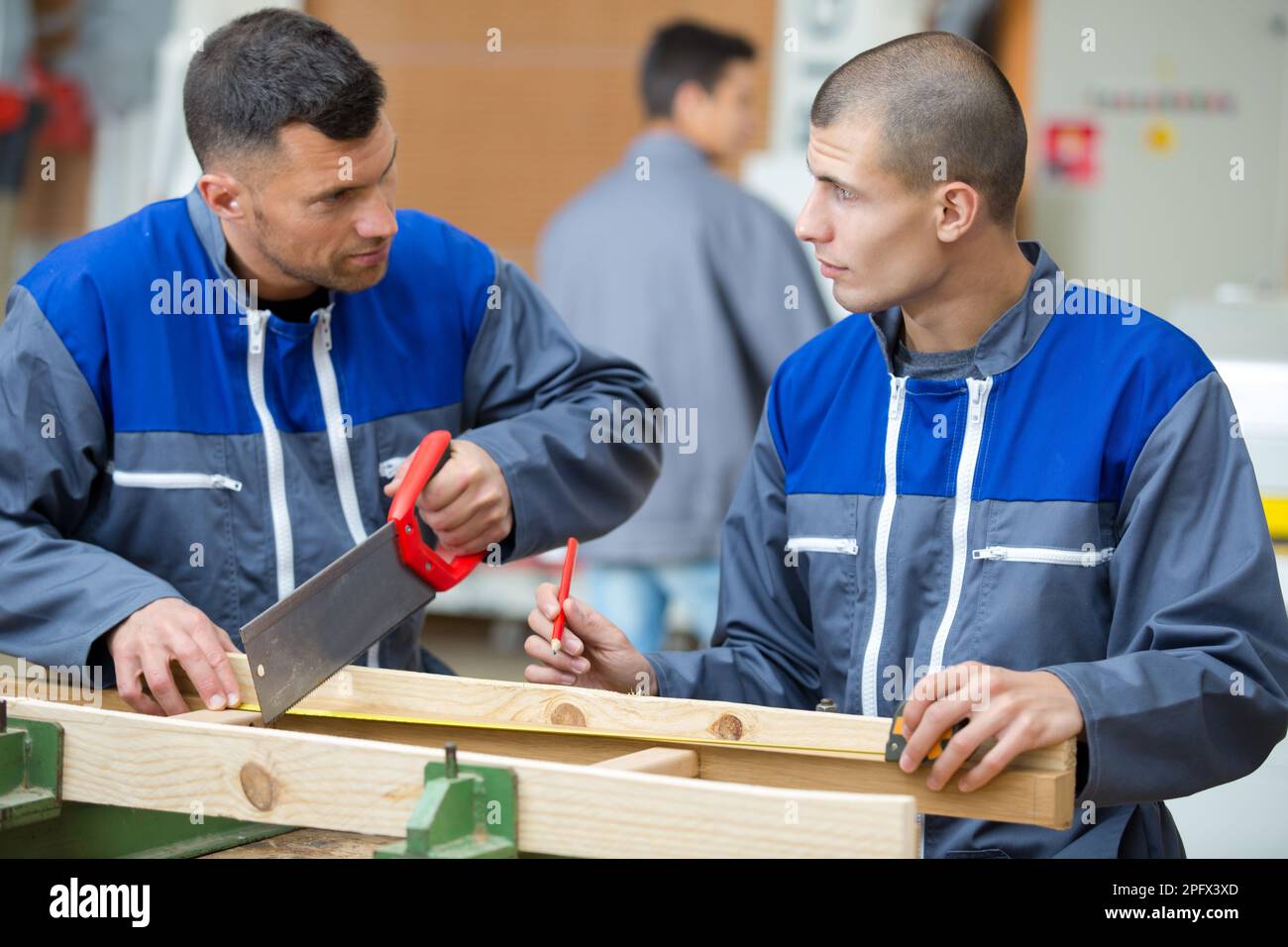 Female apprentice learning saw hi-res stock photography and images - Alamy