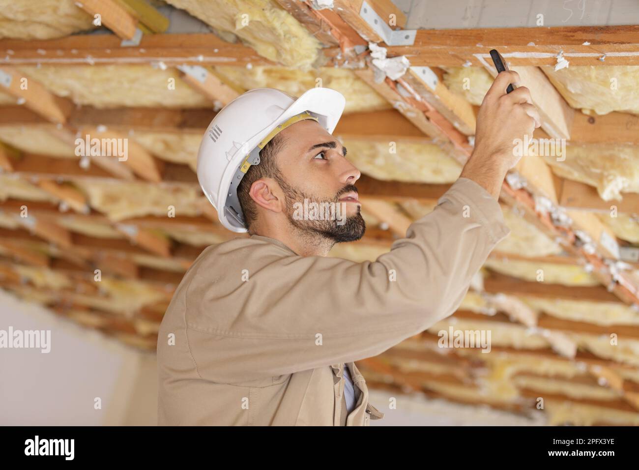 man installing thermal roof insulation layer Stock Photo - Alamy