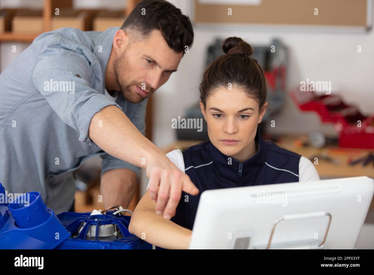 Female apprentice learning tool hi-res stock photography and images - Alamy