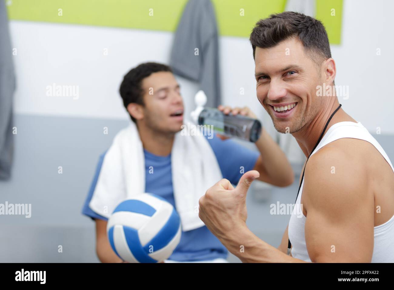 happy coach and player talking in changing room Stock Photo - Alamy