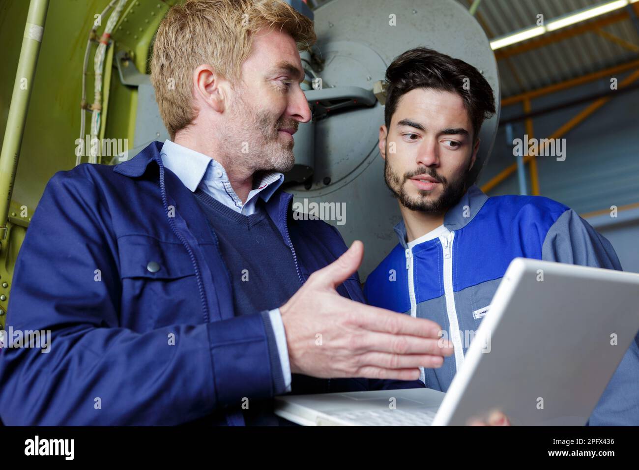 two workers are laptop engineers Stock Photo - Alamy