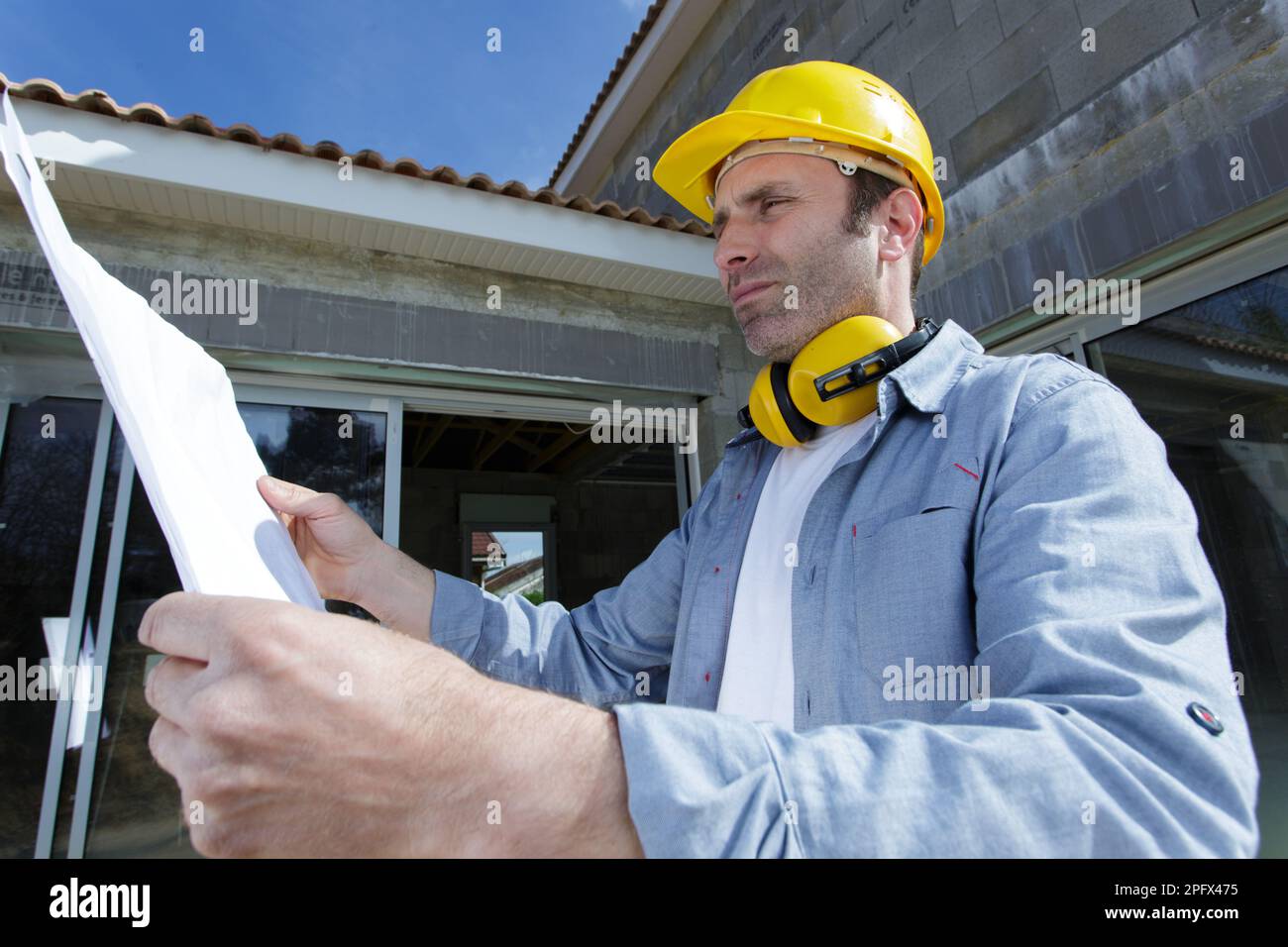 attractive builder during preparation for construction Stock Photo - Alamy