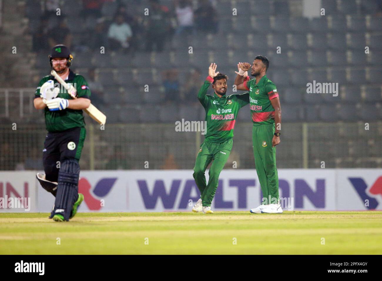 Ebadot Hossain celebrates his one of four wickets along teammates ...