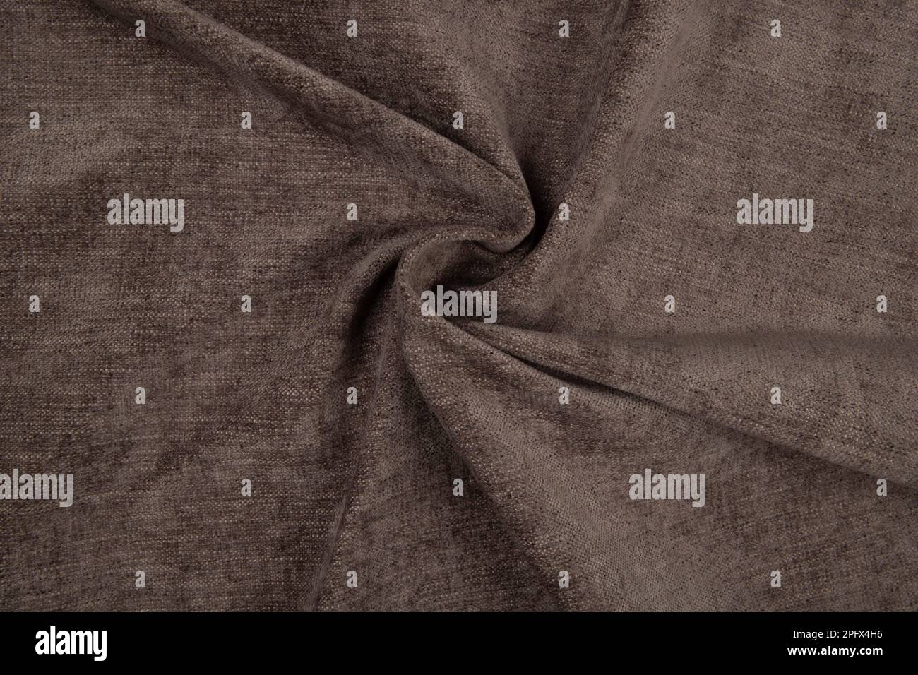 Brown fabric texture - top view and close-up of a piece of crushed and ...