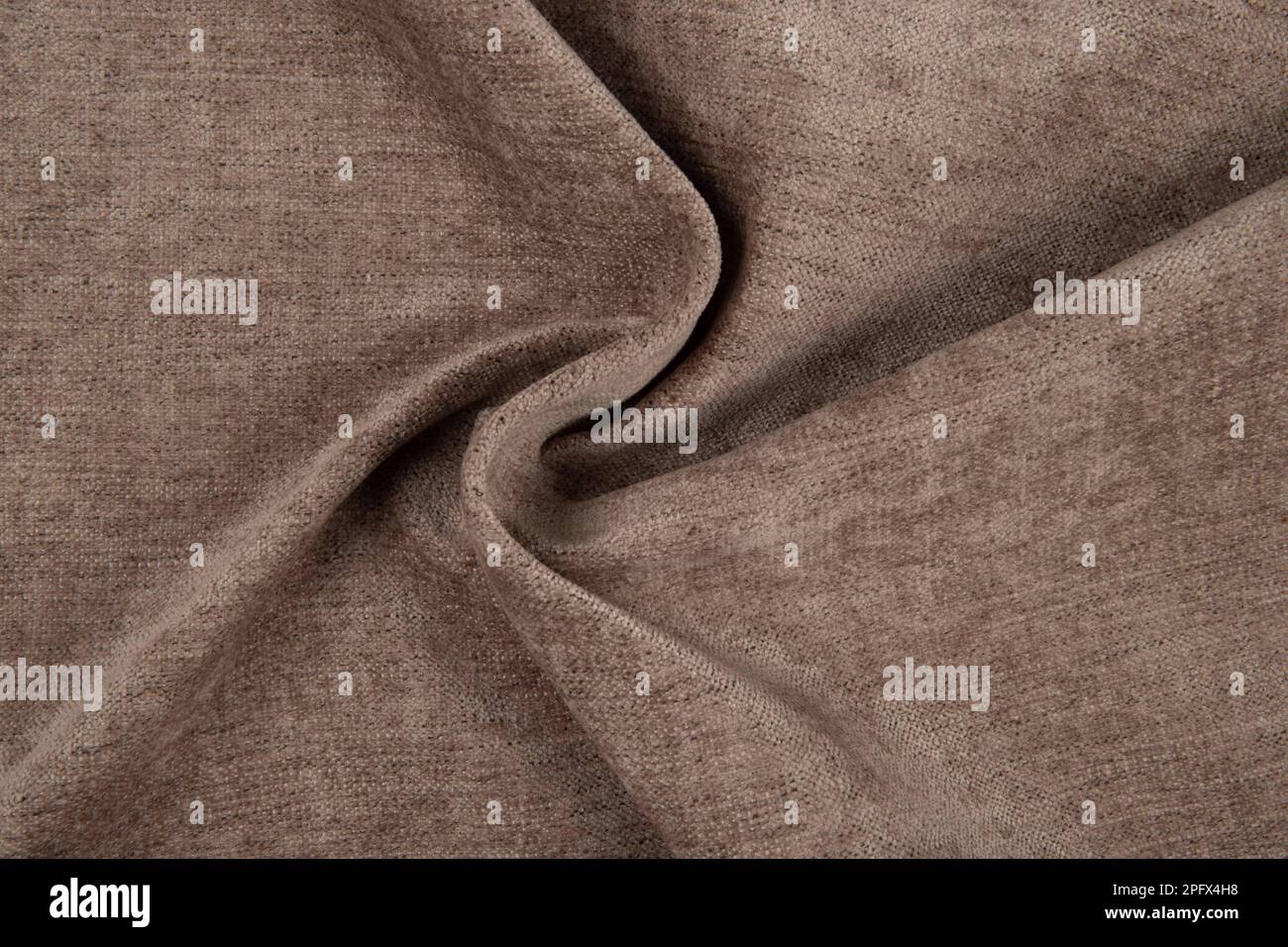 Brown fabric texture - top view and close-up of a piece of crushed and ...