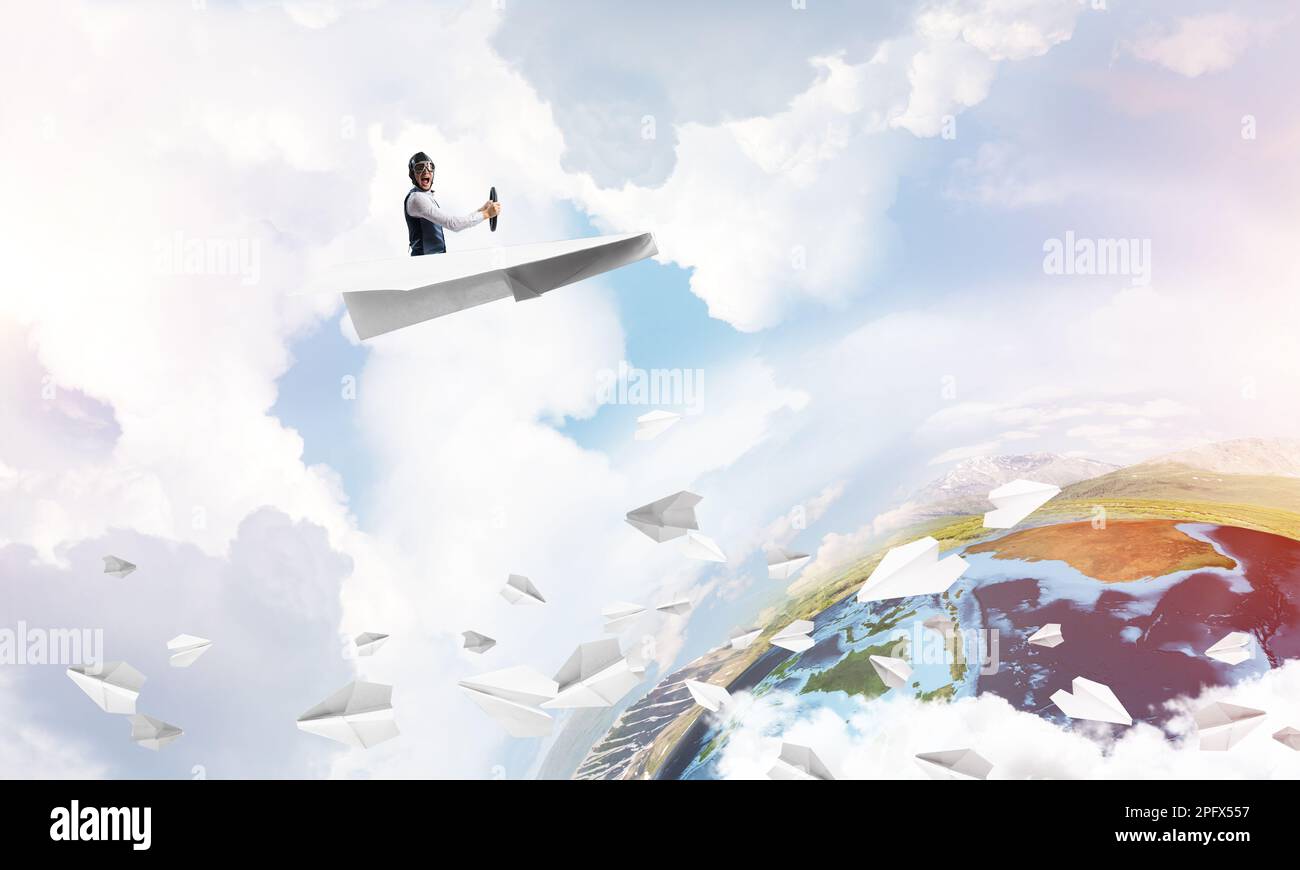 Pilot in leather helmet driving paper plane Stock Photo - Alamy