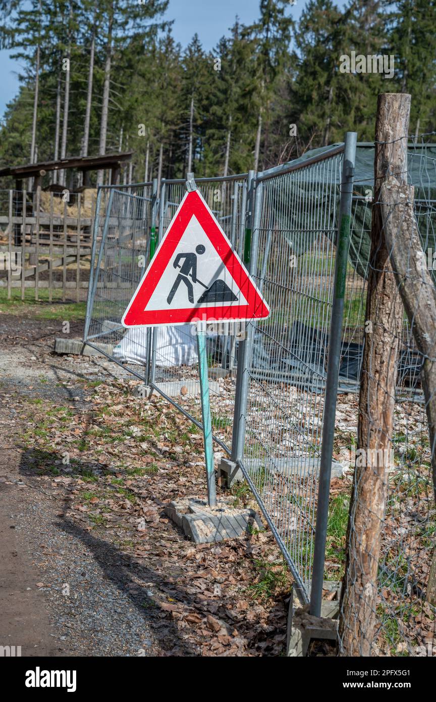 Construction area with german red triangle shape sign standing next to ...