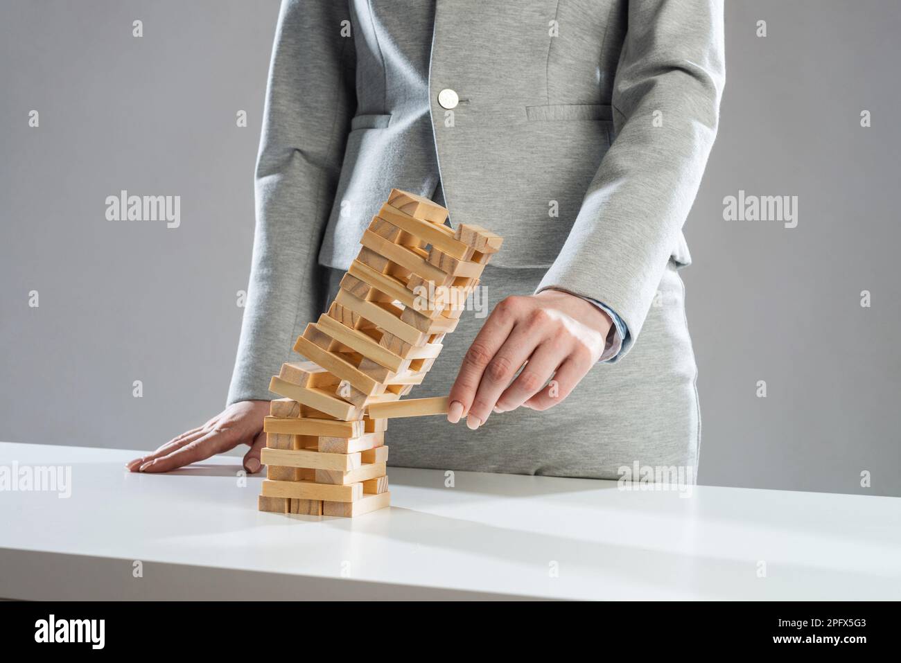 Woman removing block from hi-res stock photography and images - Alamy