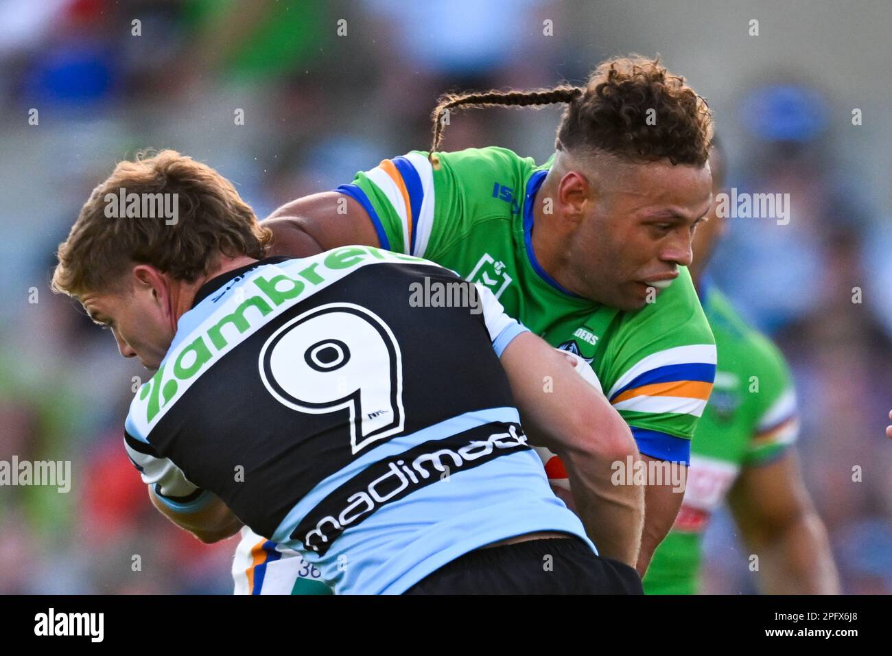Sebastian Kris of the Raiders (right) is tackled by Blayke Brailey of ...