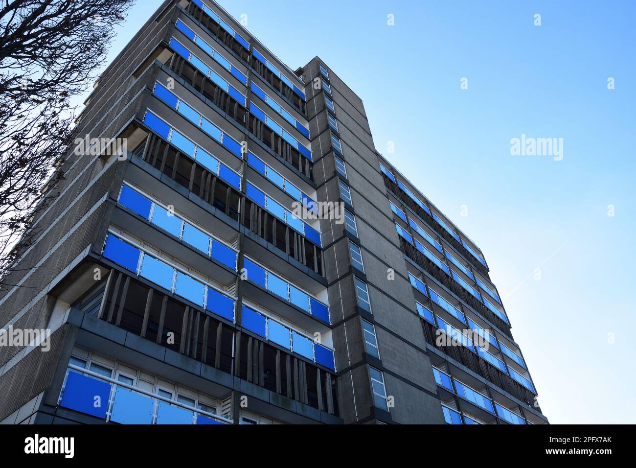 Concrete multi story building with blue cladding Stock Photo - Alamy