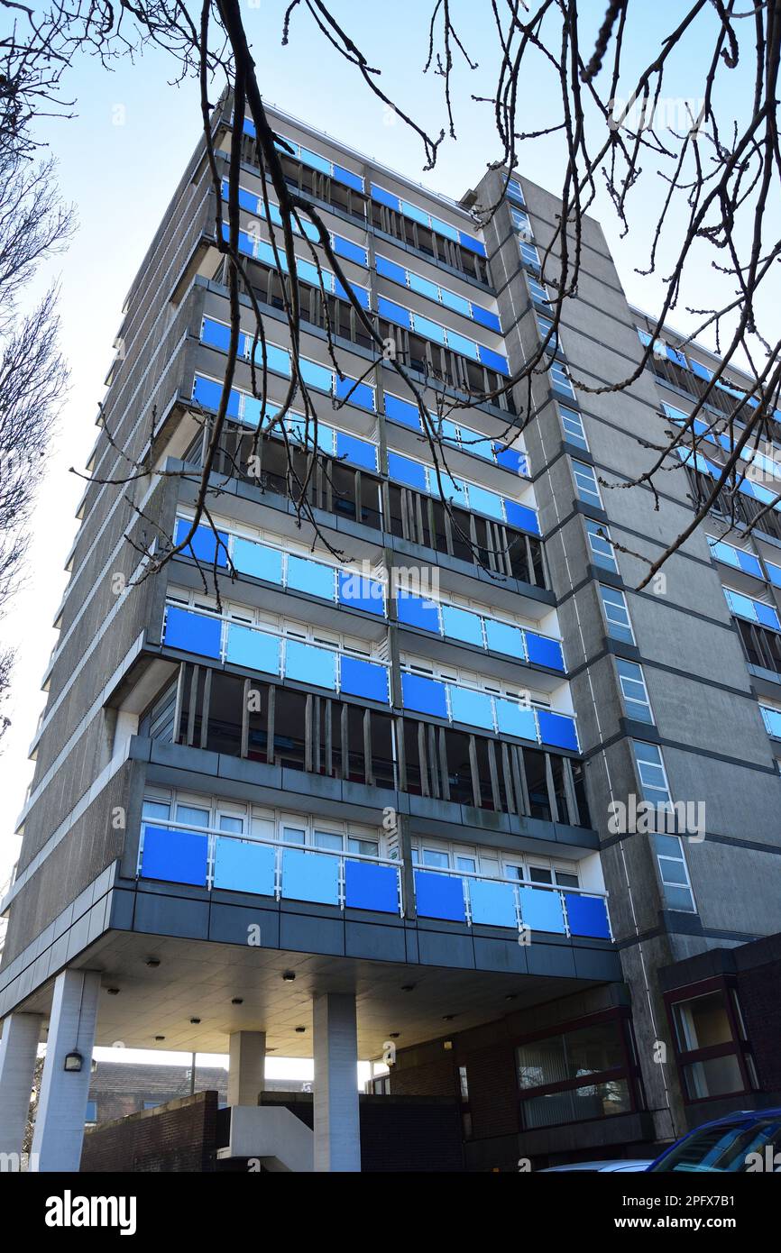 Concrete multi story building with blue cladding Stock Photo - Alamy