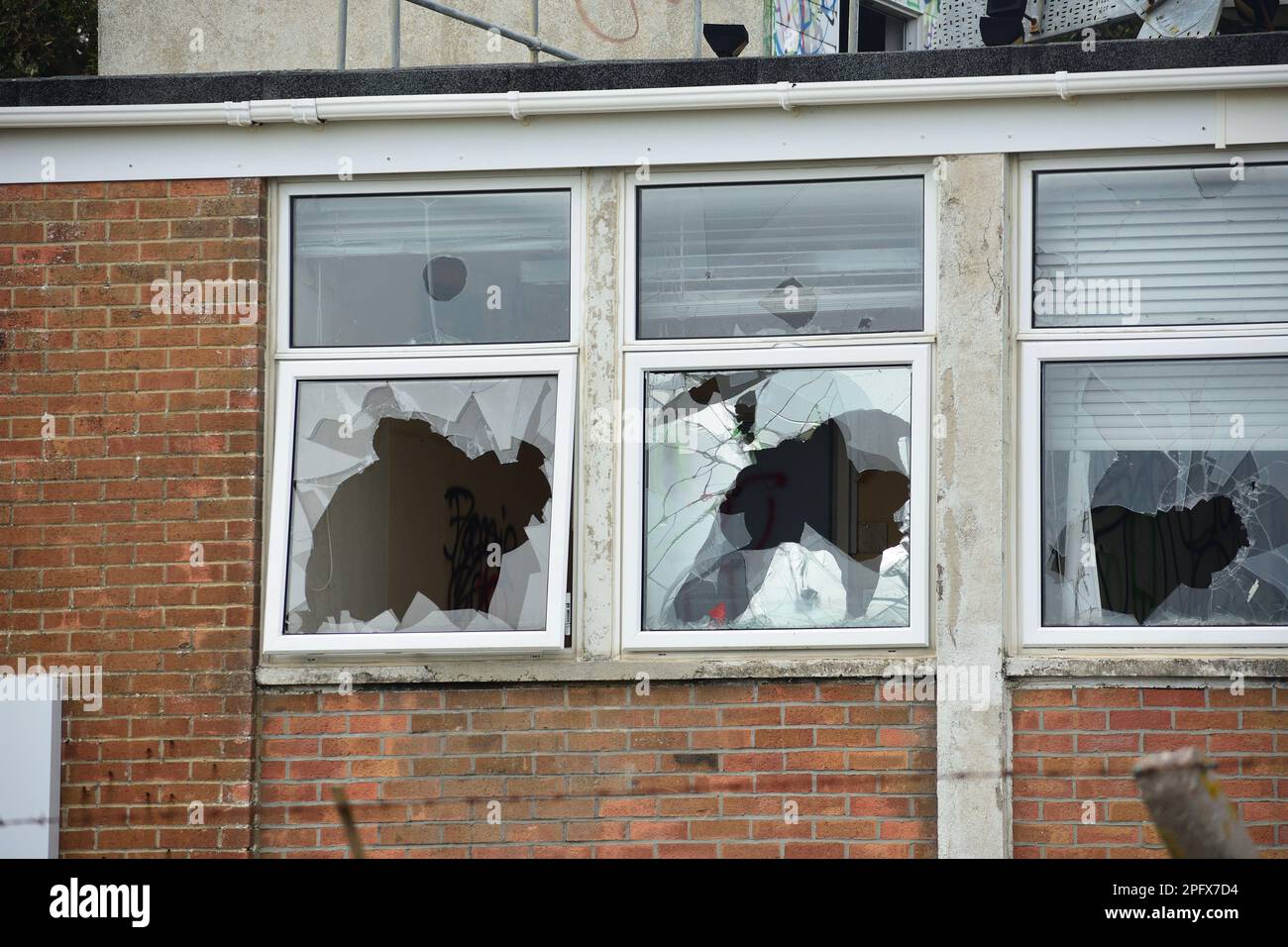 Brocken windows with white UPVC frames Stock Photo - Alamy