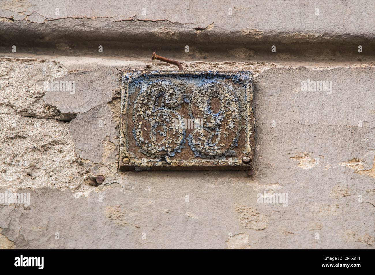 Old retro weathered cast iron plate with number 69 Stock Photo - Alamy
