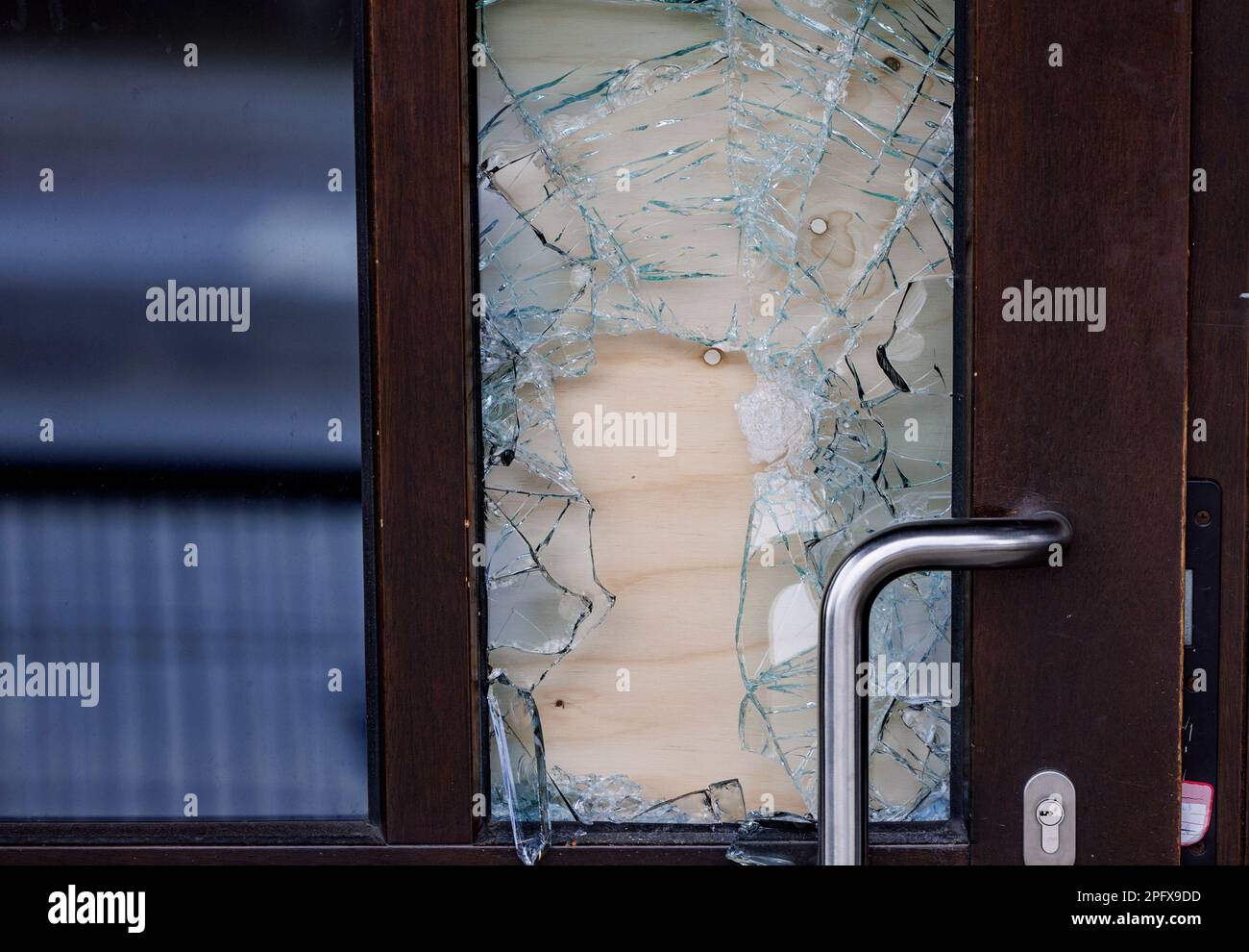 Hamburg, Germany. 19th Mar, 2023. A broken window is taped with ...
