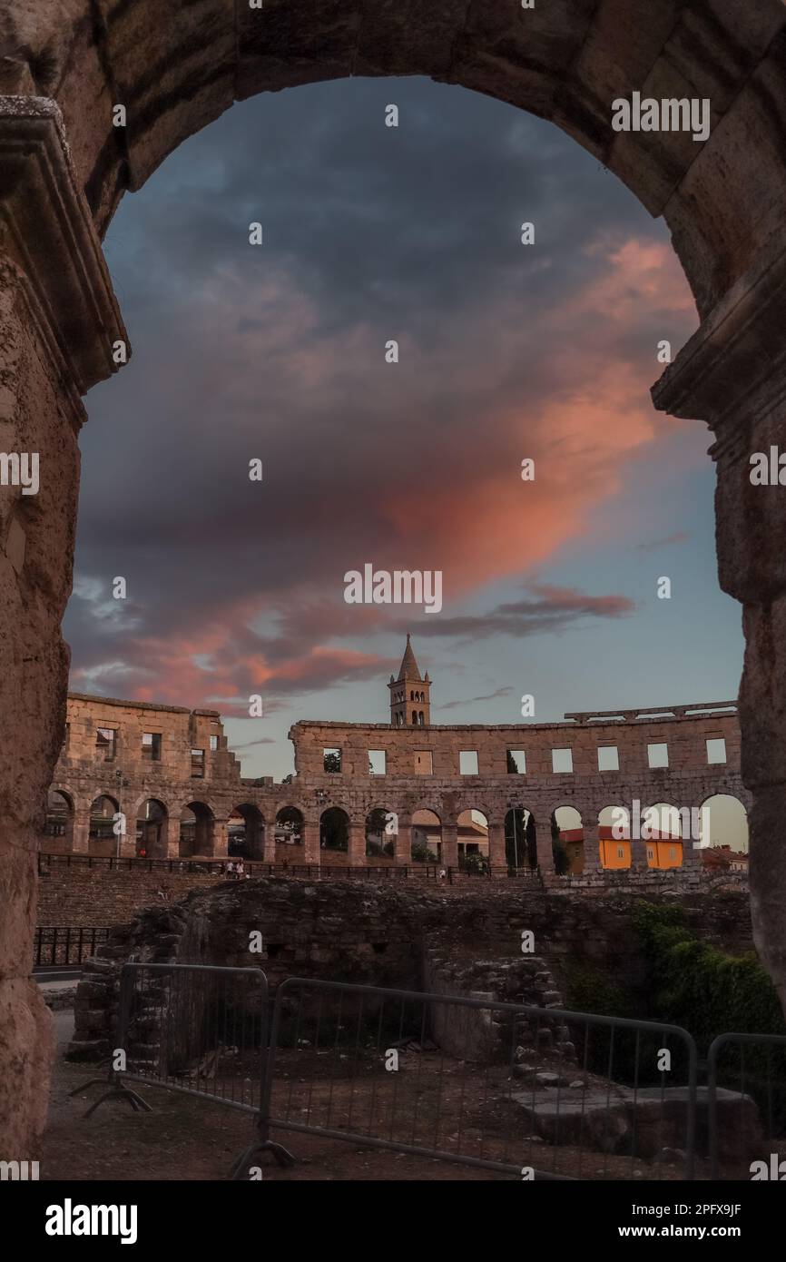 Pula Arena View through Arch with Sunset Sky. Majestic Roman ...