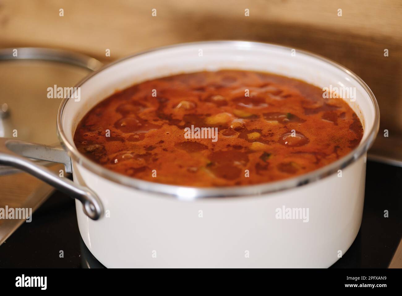 Mexican traditional dish is boiling in white pans. Home made food ...