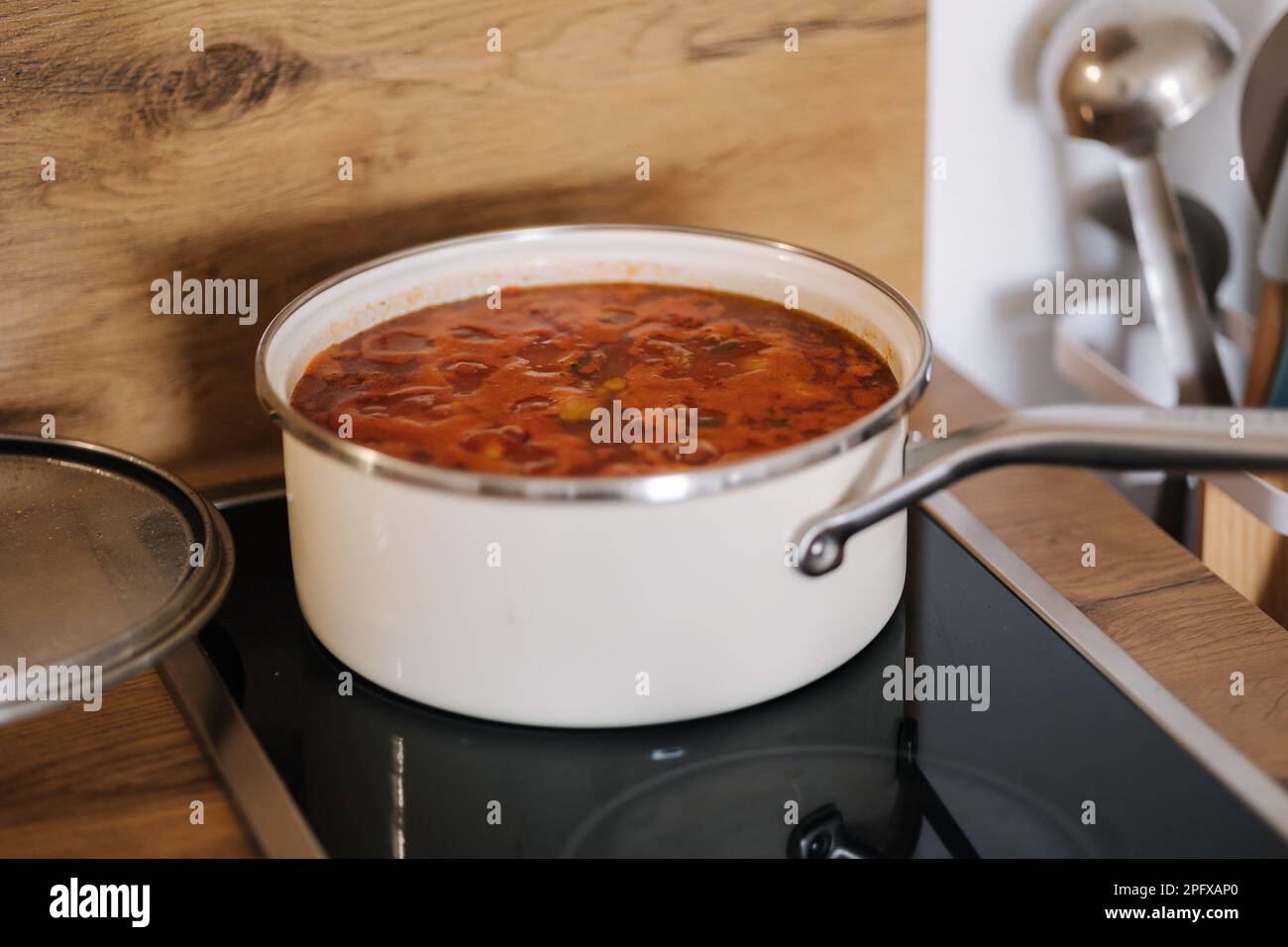 Mexican traditional dish is boiling in white pans. Home made food ...