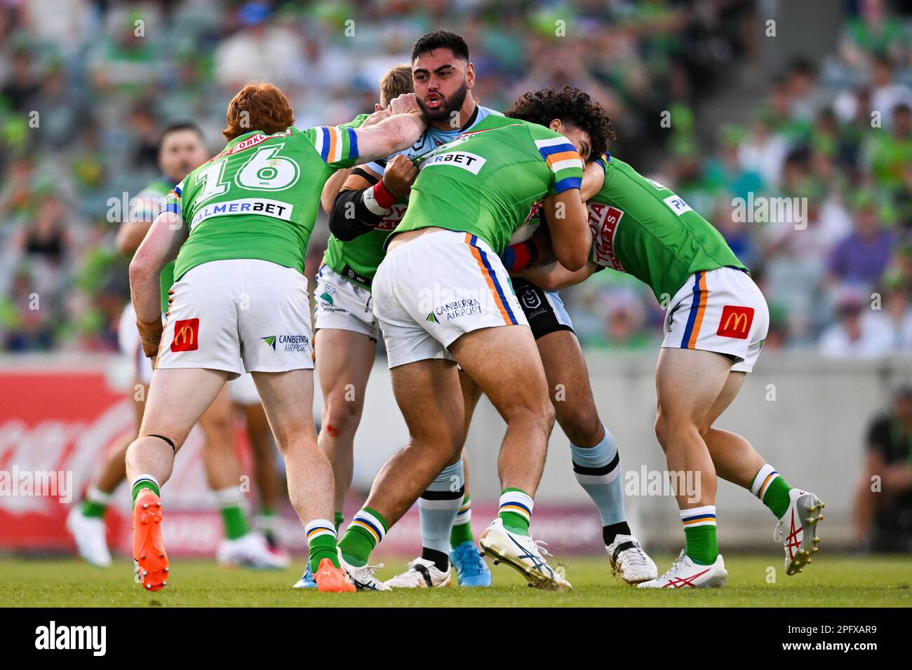 Briton Nikora of the Sharks is tackled by Corey Horsburgh of the ...