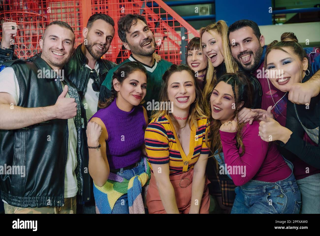 A lively group of 10 young adults, mostly Caucasian with one Asian ...