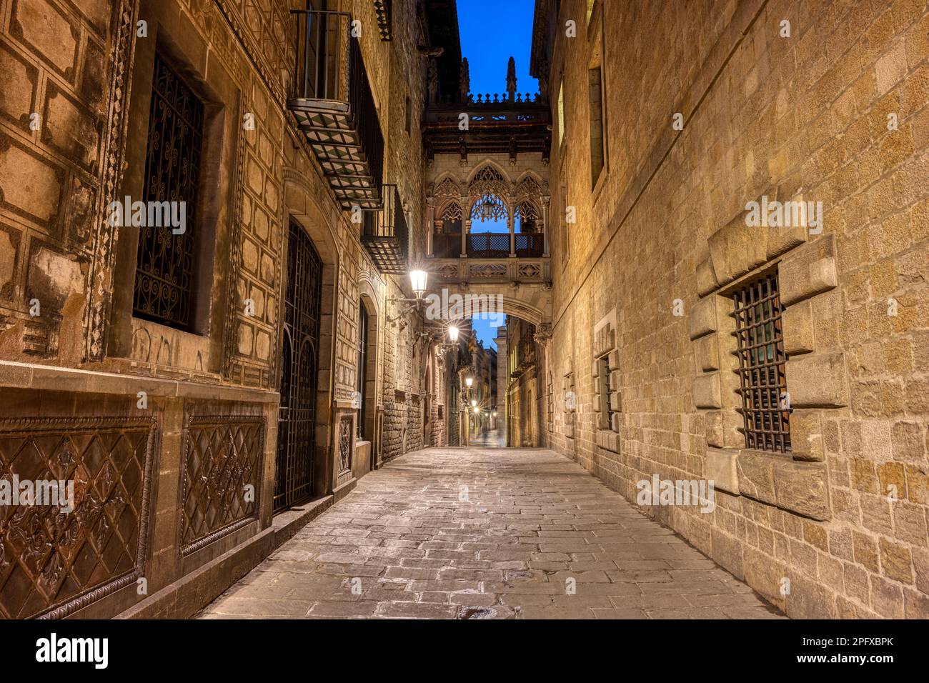 Small alley in the Gothic Quarter in Barcelona at night with the Pont ...