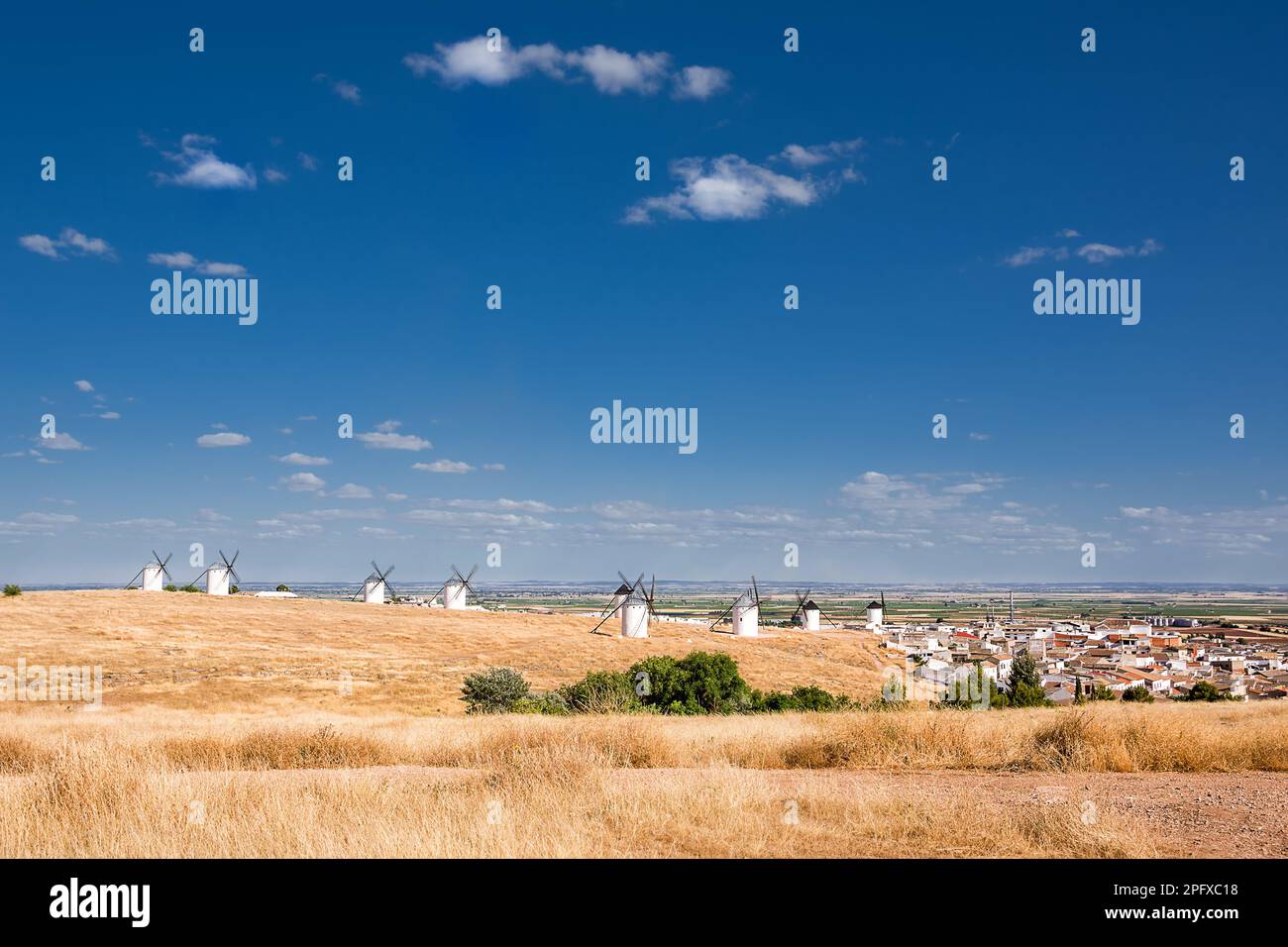 Dry field with ancient windmills and below the village of Campo de ...