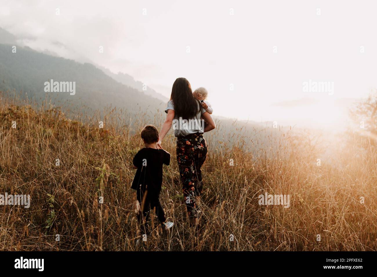 Mom communicates with two children hi-res stock photography and images ...