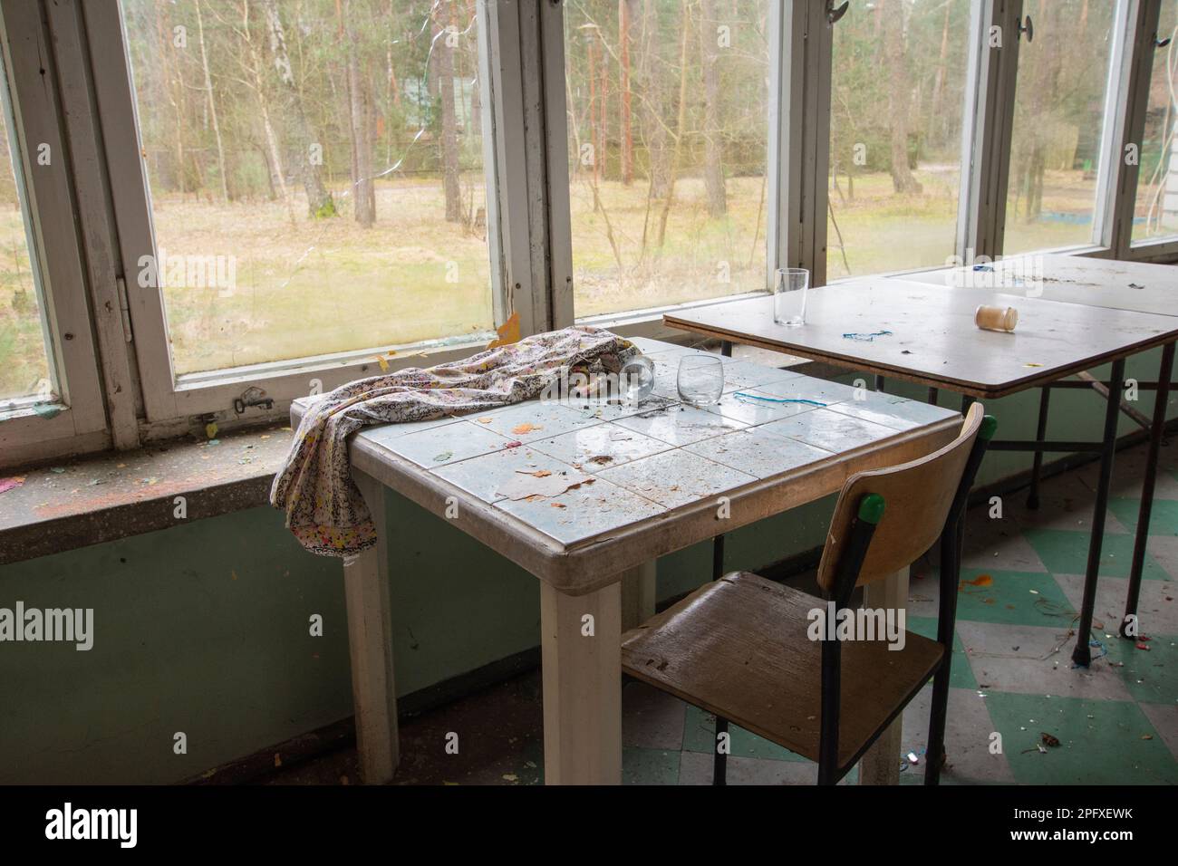 Old, dilapidated tables and coffee tables in an abandoned building ...