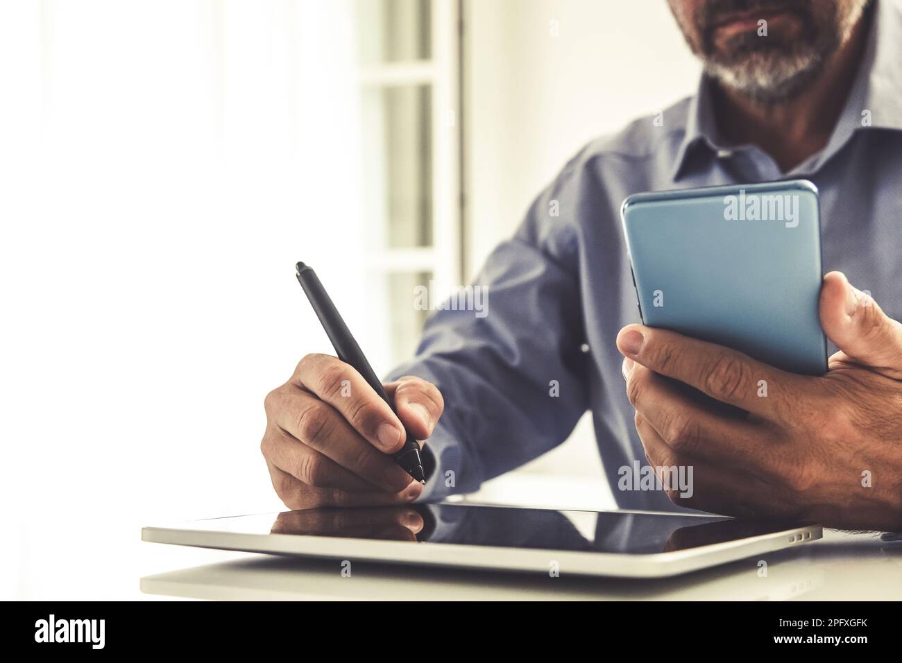 Closeup man hands using smartphone. Businessman works with tablet and ...