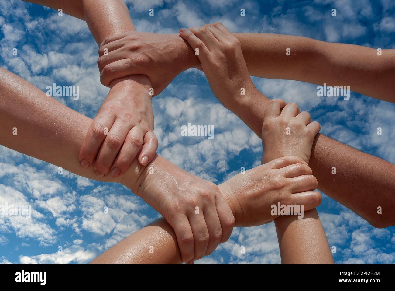 Many hands of people connect or link together community of cooperation ...