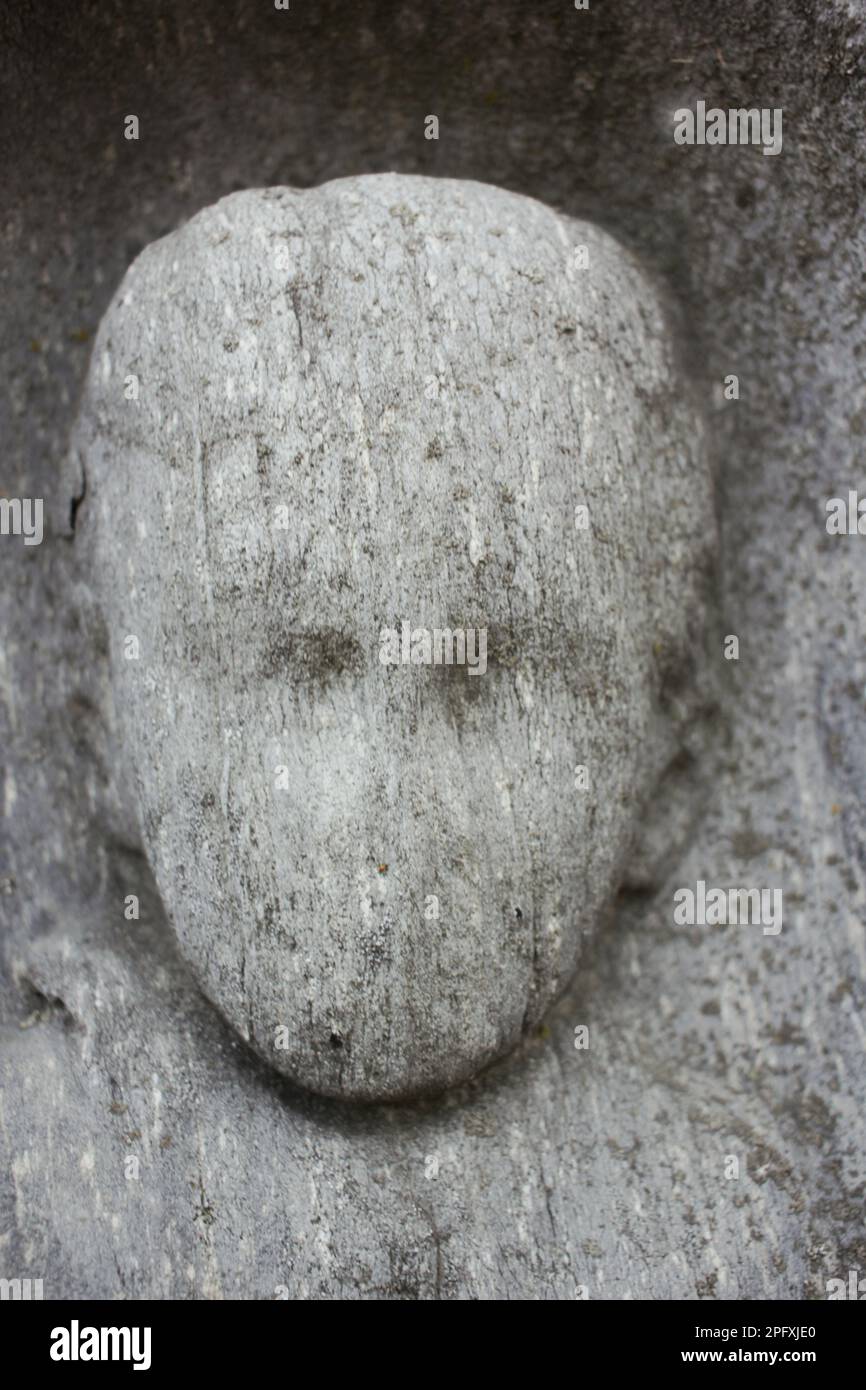 A worn and weathered face of a young man now looking like a ghost and ...