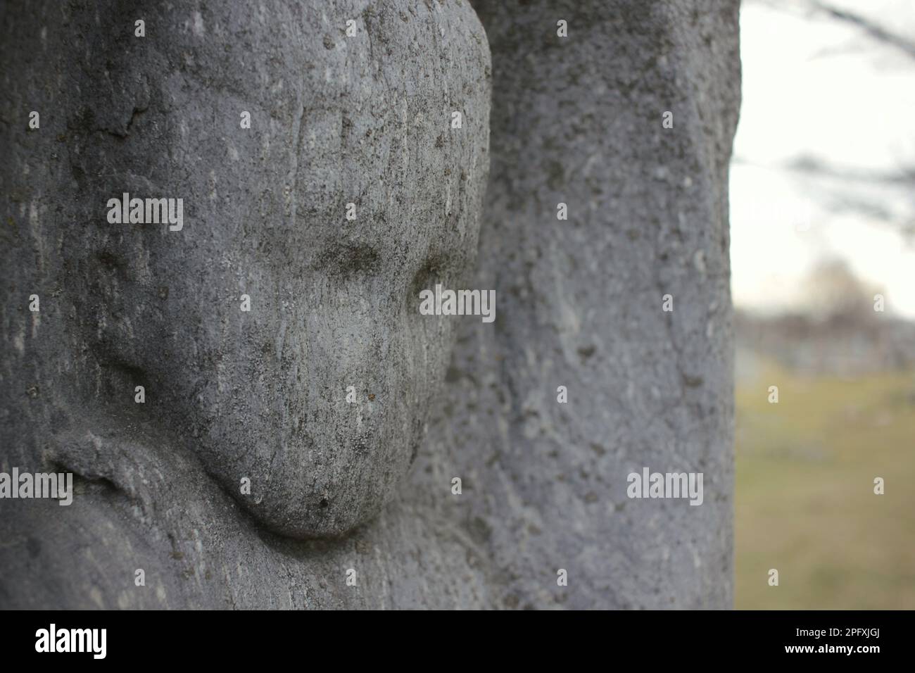 A worn and weathered face of a young man now looking like a ghost and ...