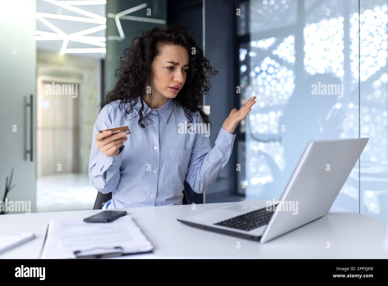 Frustrated and upset business woman inside office at workplace ...