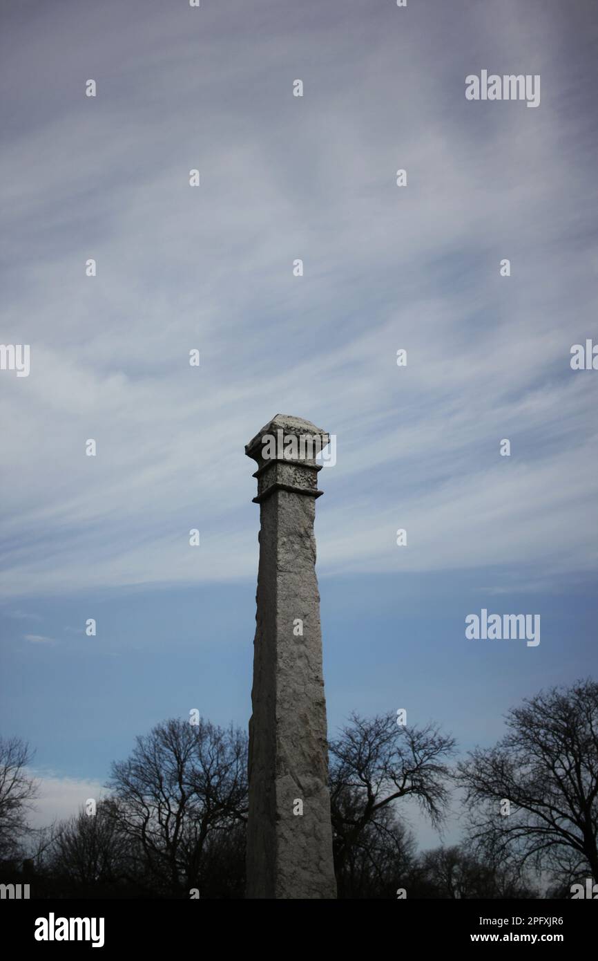 A tall chimney and brick tower standing against the sky Stock Photo - Alamy