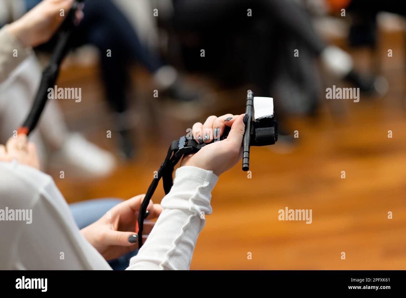 Courses in tactical medicine. A woman's hands hold a turnstile. Place ...