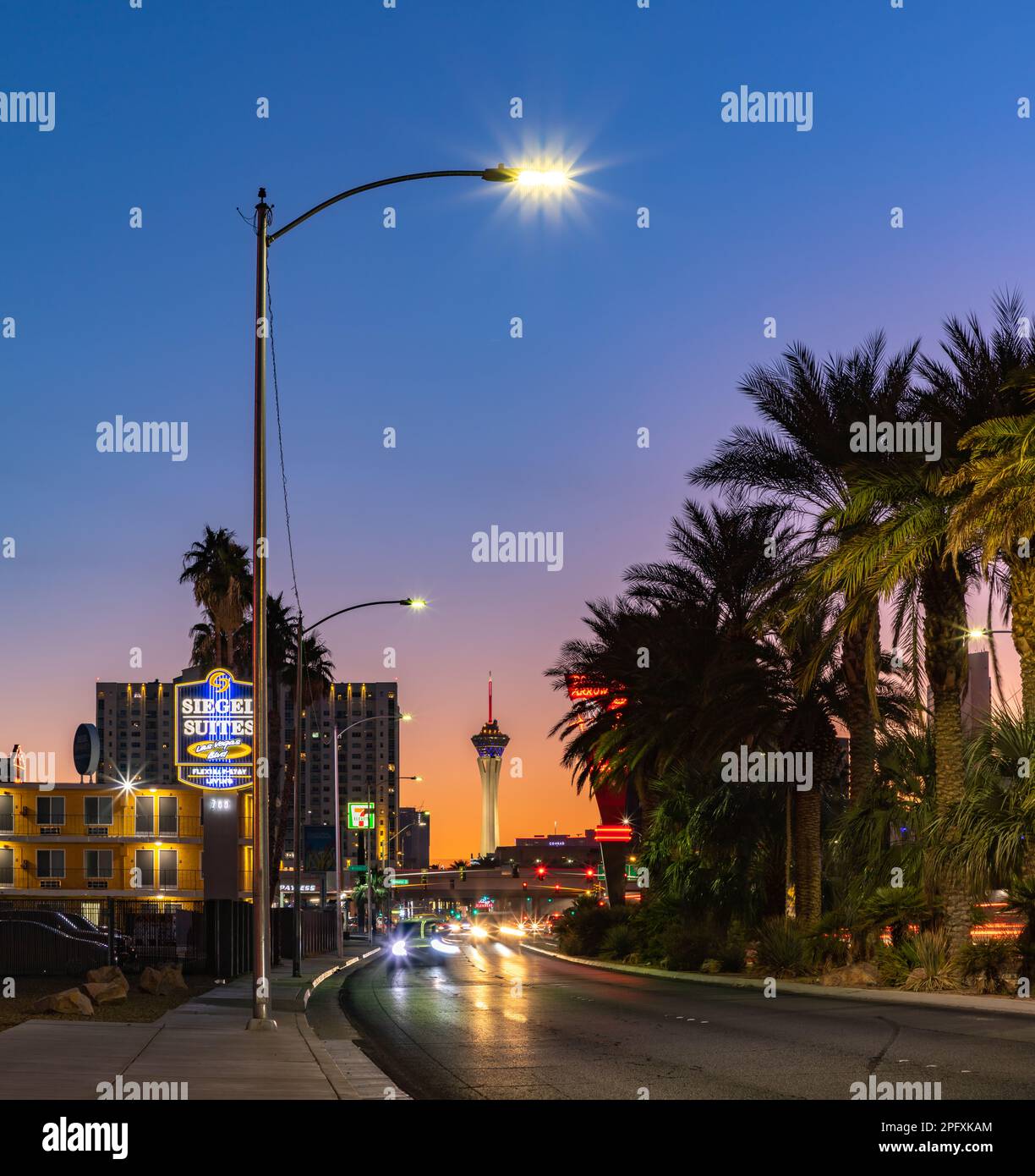 A picture of the Las Vegas Boulevard North at sunset, with the STRAT ...
