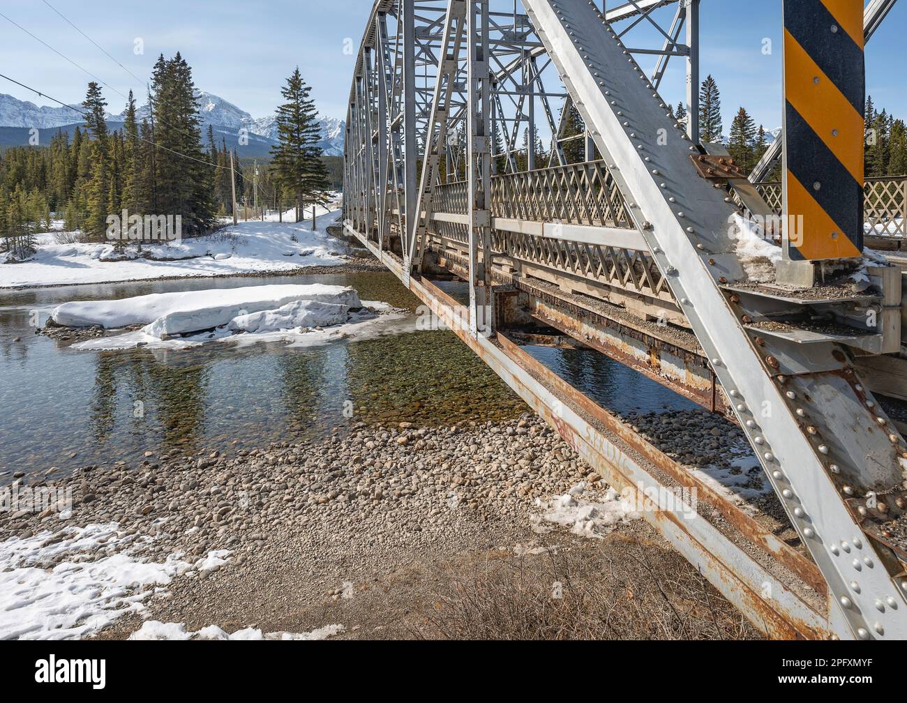 Old steel truss bridge over the Bow River at Castle Junction in Banff ...