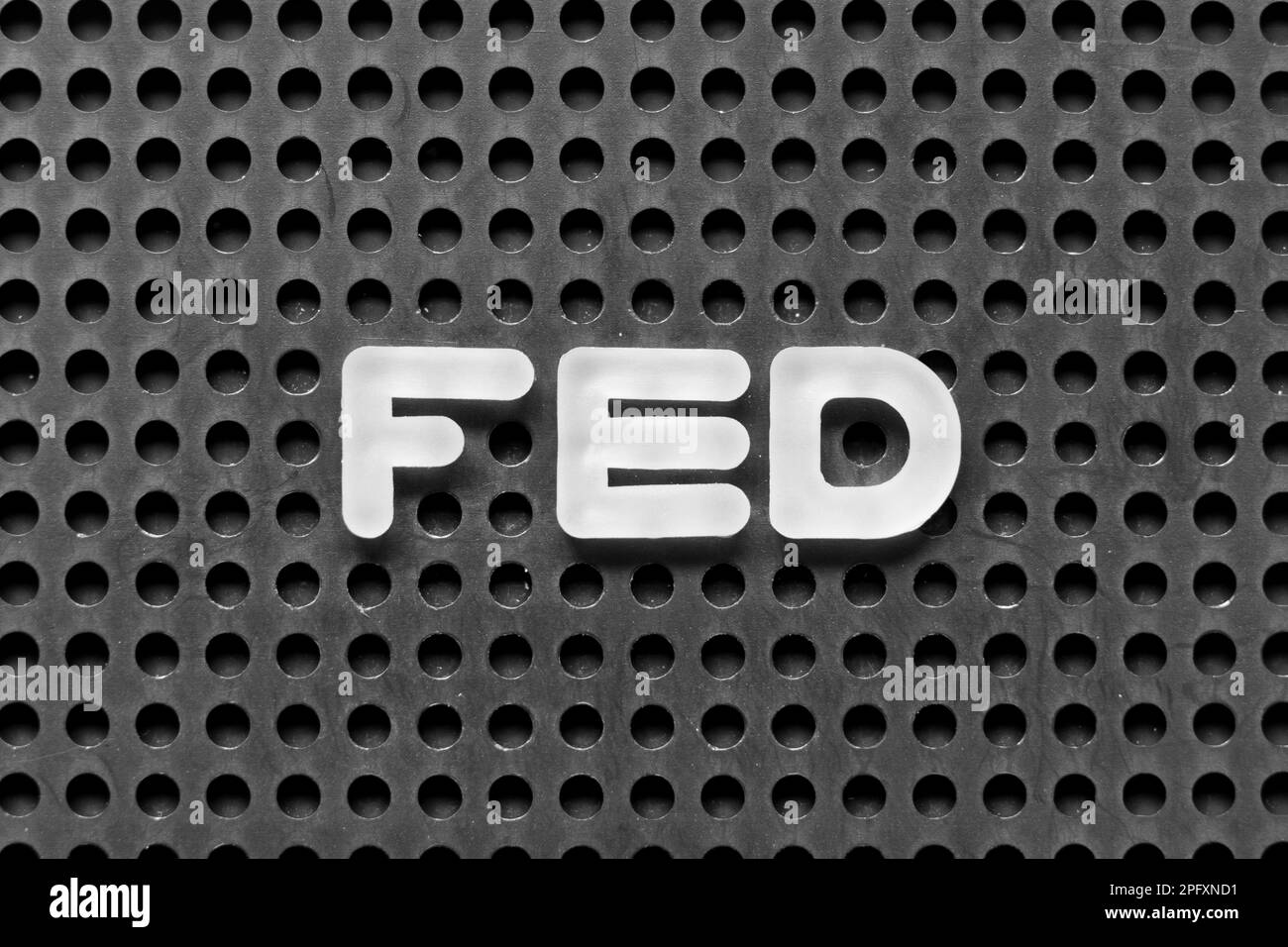 White alphabet letter in word fed on black pegboard background Stock ...