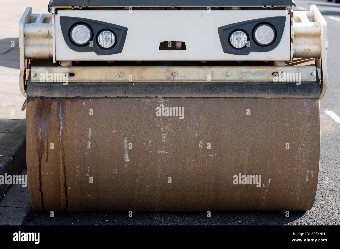Tarmac or road roller machine front that looks almost like a face with ...