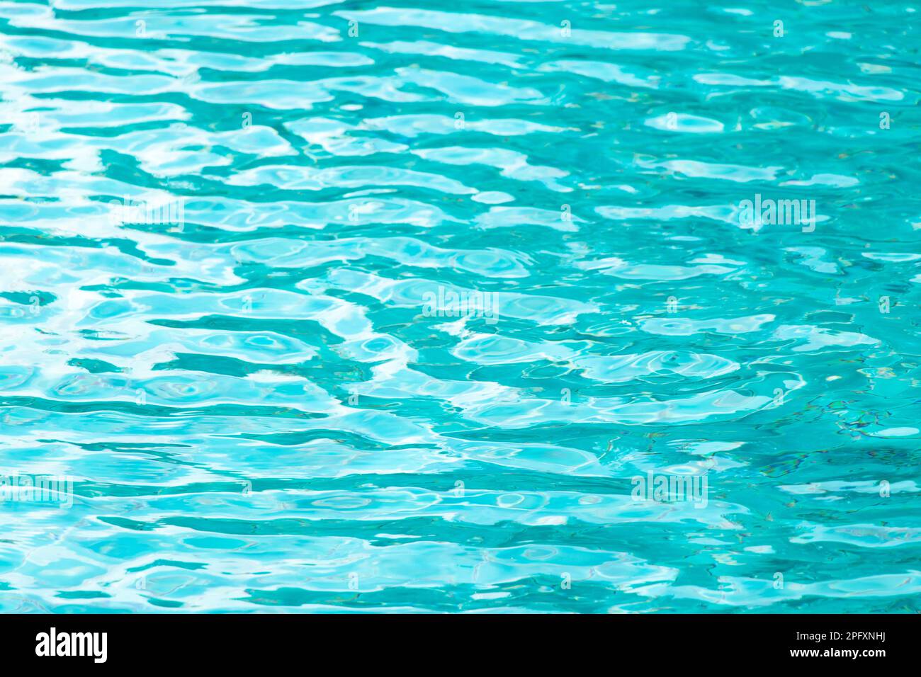 Ripple Water in swimming pool with blue tile floor background Stock ...