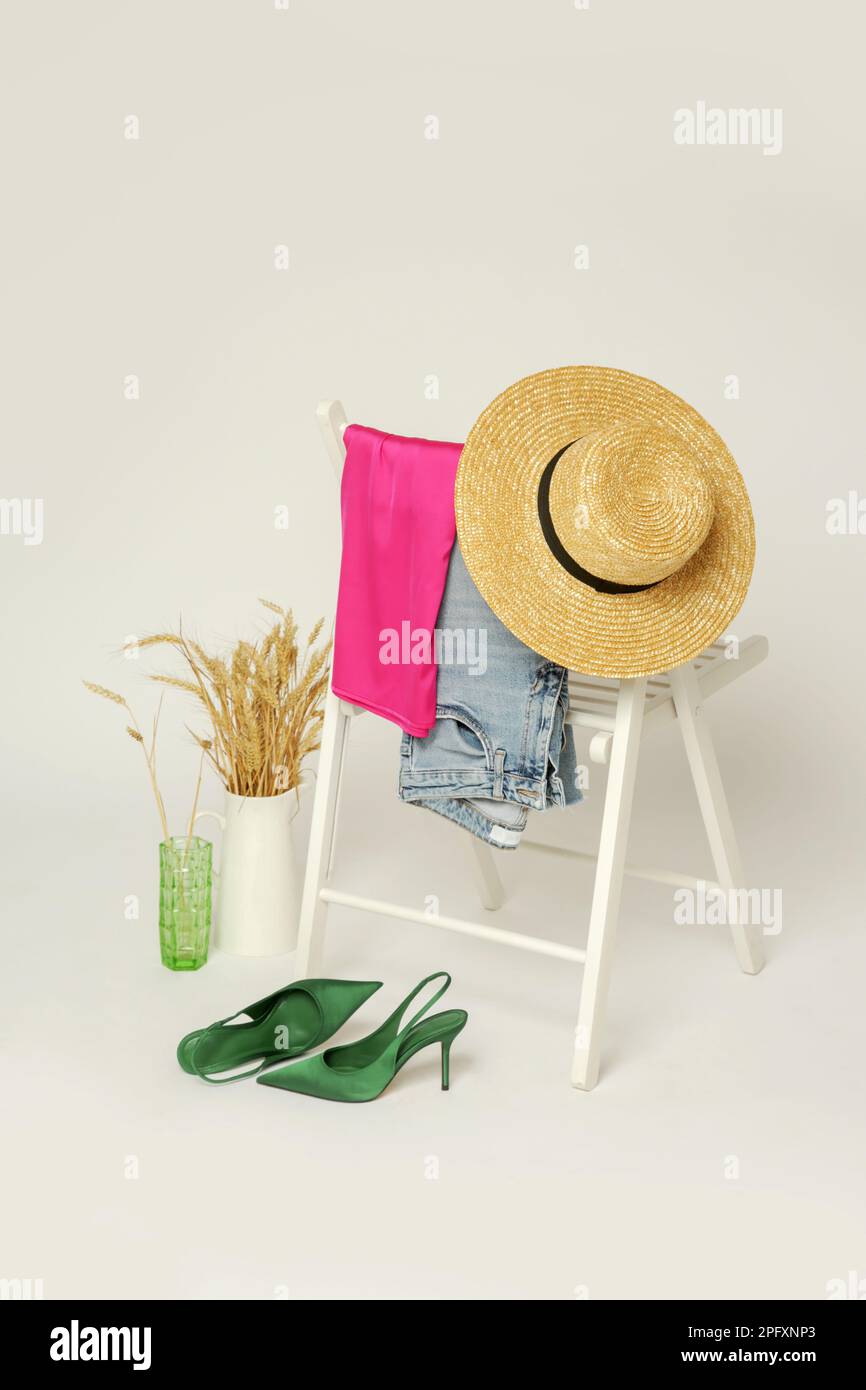 Clothes on a chair. Product photography, fashion still life. Spring ...