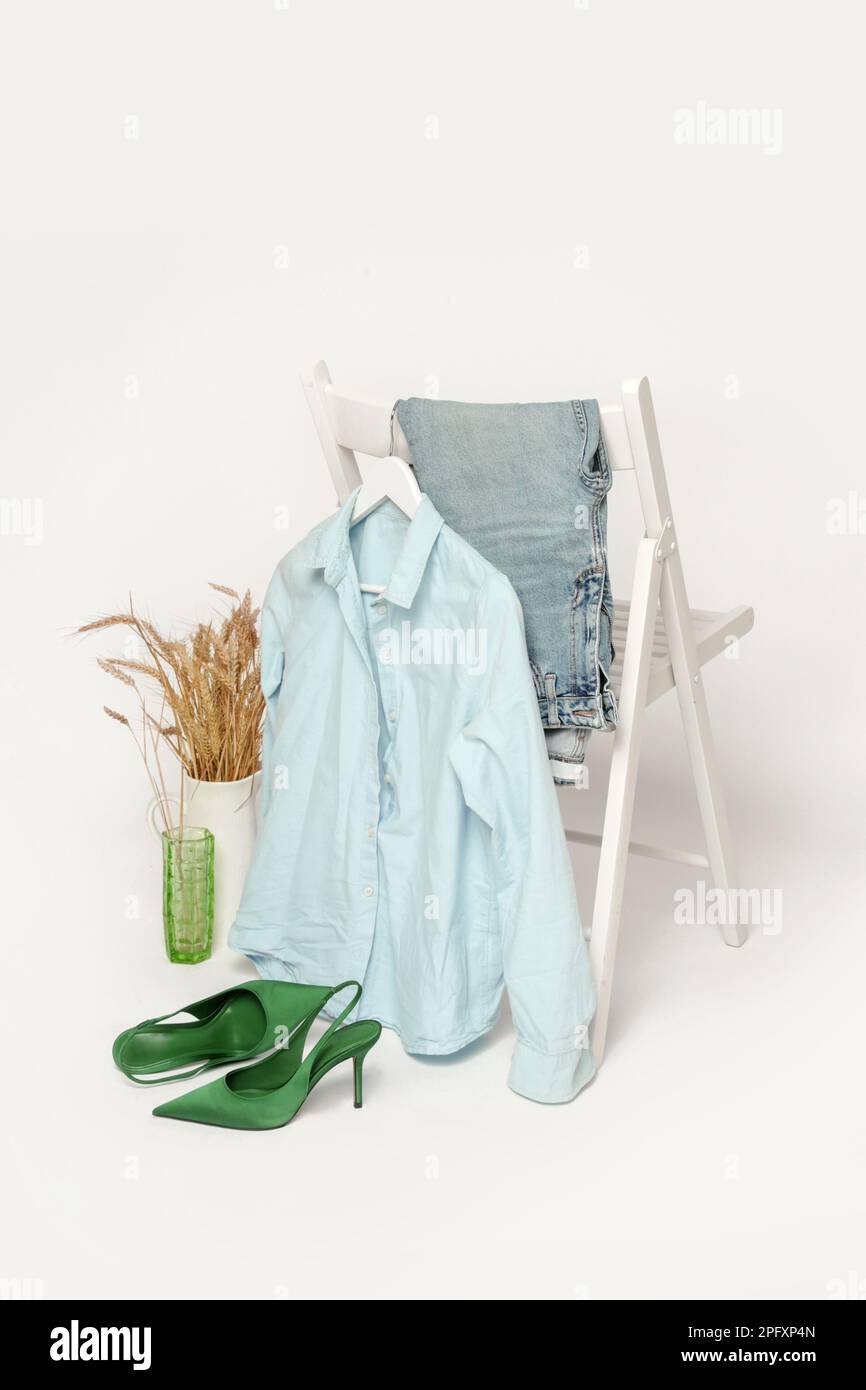 Clothes on a chair. Product photography, fashion still life. Spring ...