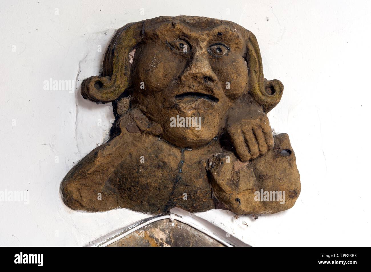 A stone carving inside St. Luke`s Church, Duston, Northamptonshire ...