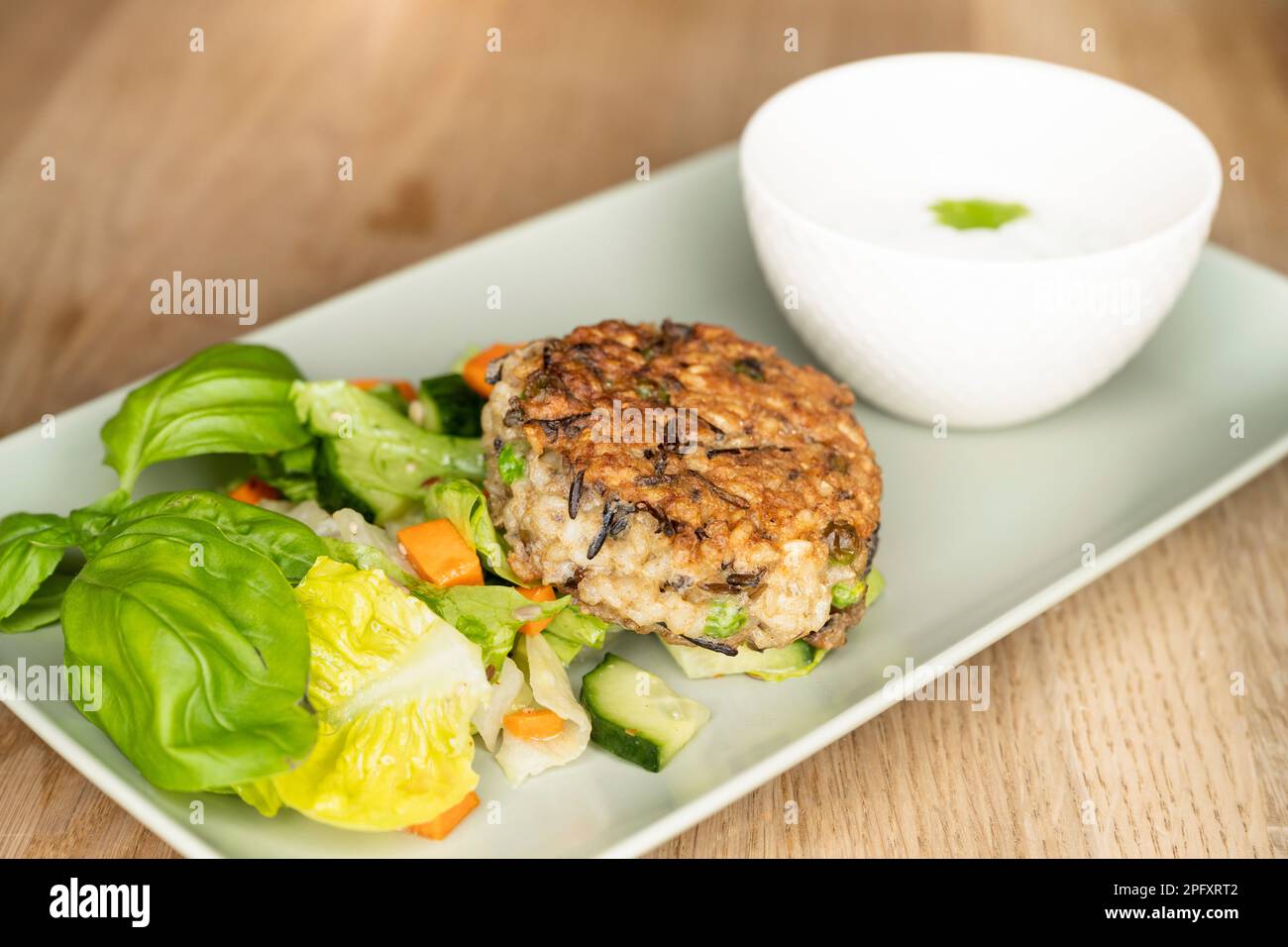 Rice patty with fresh basil, cucumber and carrots, salt with a creamy ...